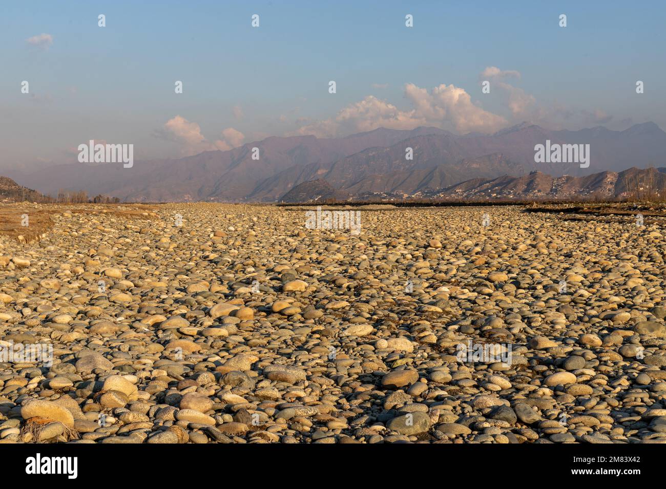 Dried river bed with stones and pebbles rocks. Concept of drought Stock ...