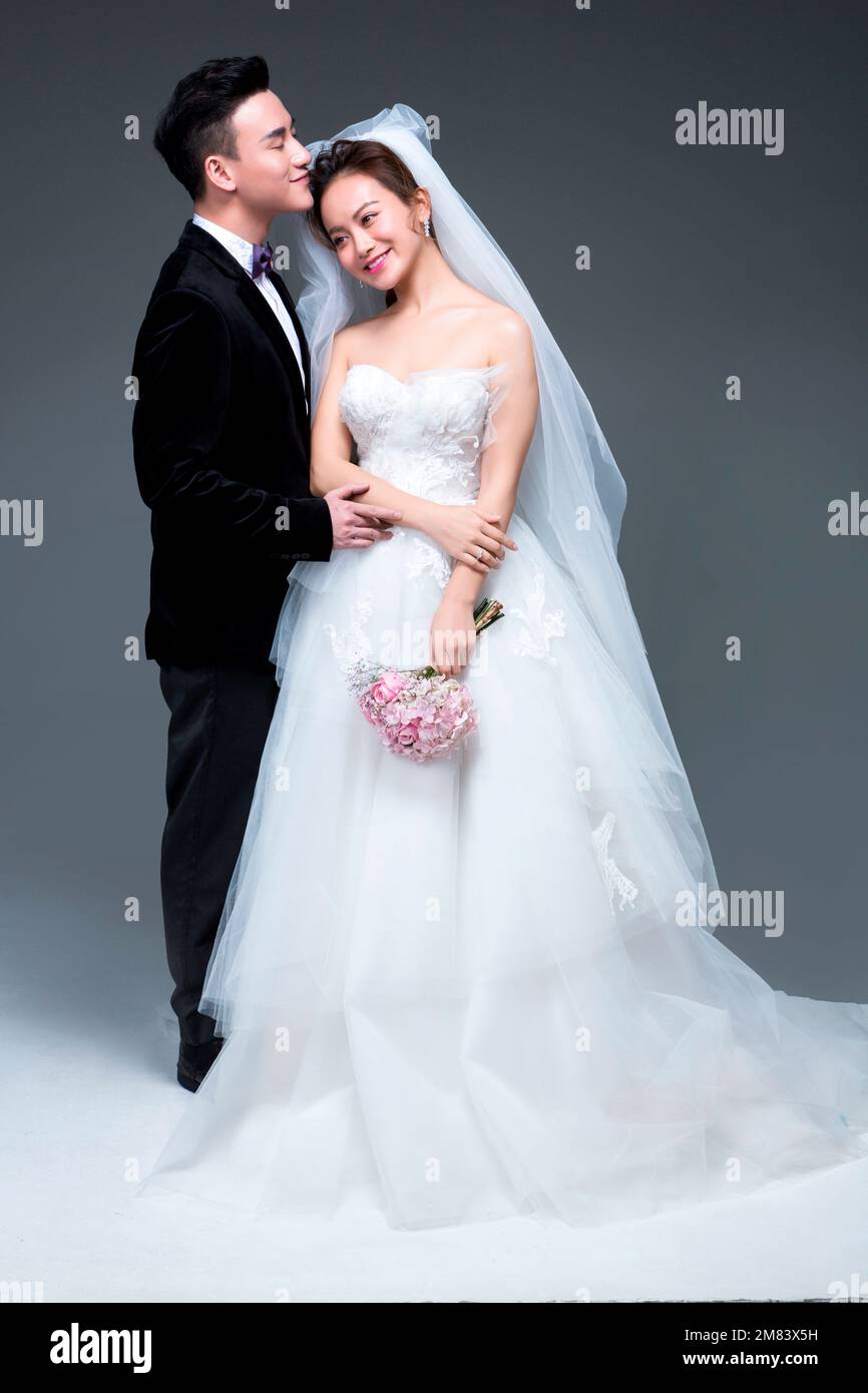 Happy and sweet bride and groom Stock Photo - Alamy