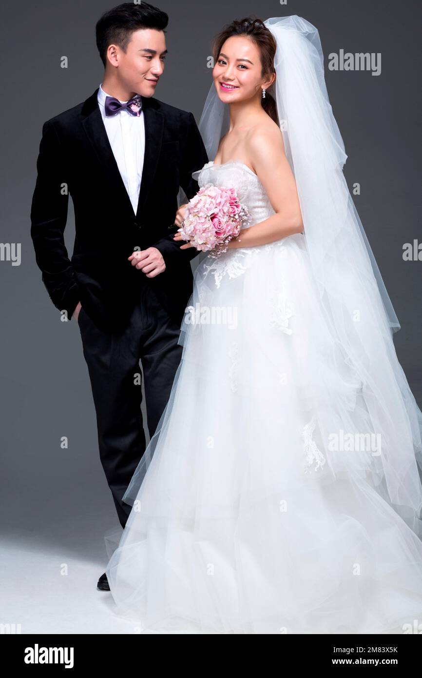 Happy and sweet bride and groom Stock Photo - Alamy