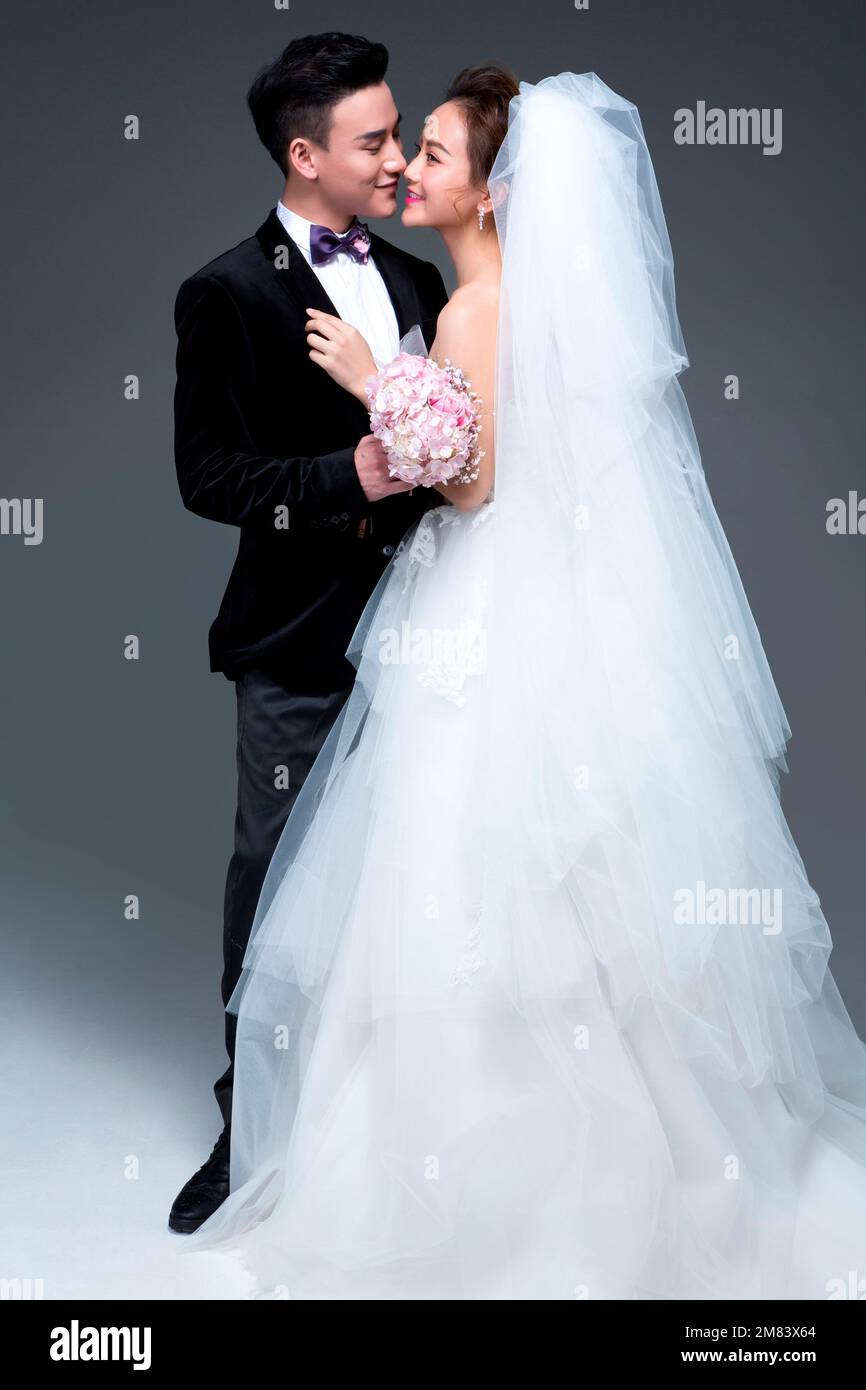Happy and sweet bride and groom Stock Photo - Alamy