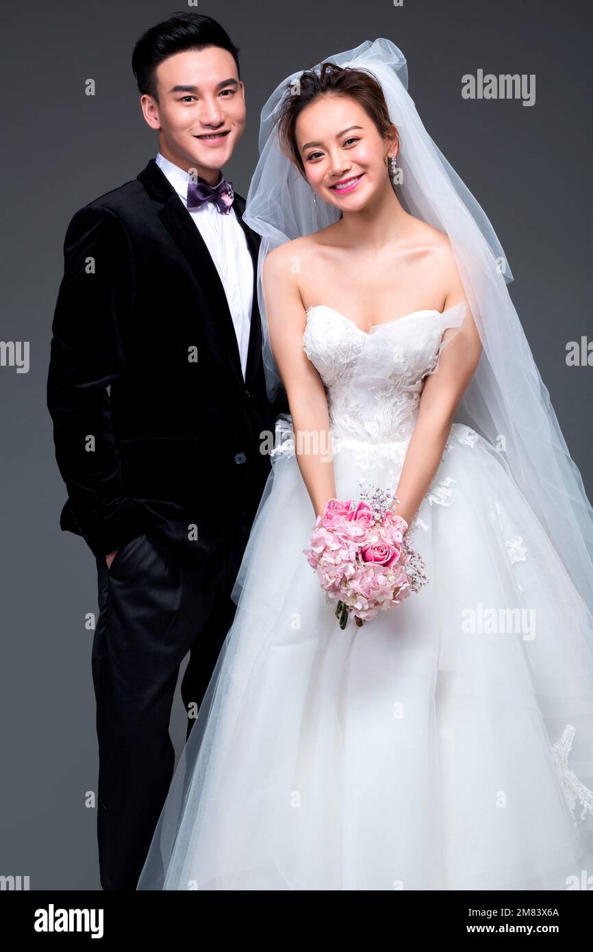 Happy and sweet bride and groom Stock Photo - Alamy