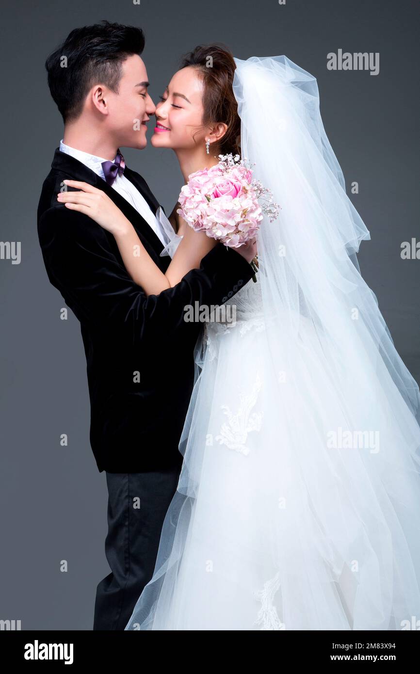 Happy and sweet bride and groom Stock Photo - Alamy