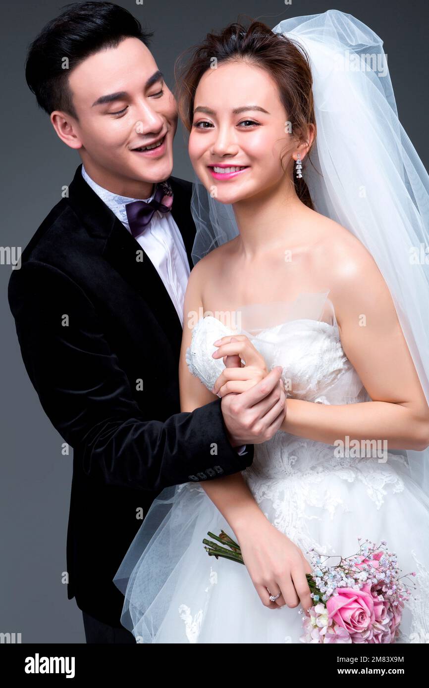 Happy and sweet bride and groom Stock Photo - Alamy