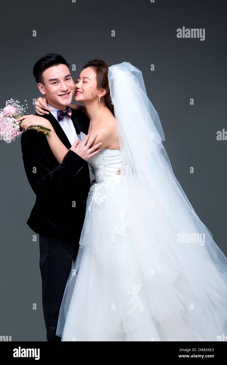 Happy and sweet bride and groom Stock Photo - Alamy