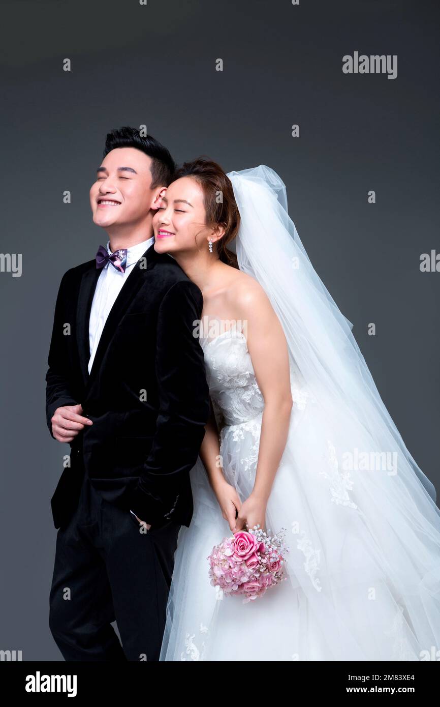 Happy and sweet bride and groom Stock Photo - Alamy