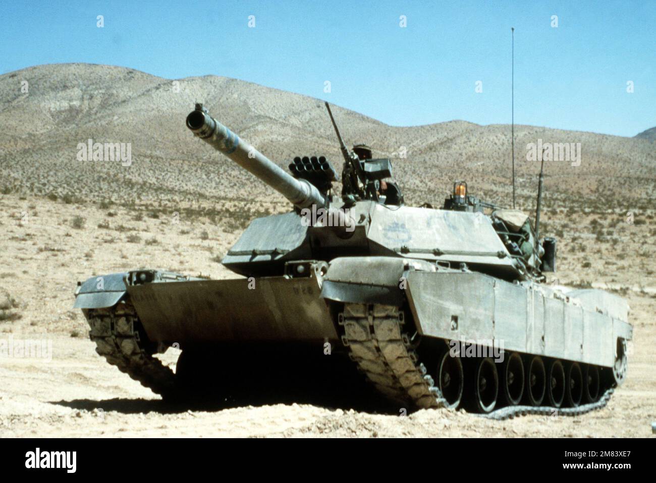 Members of the 1ST Cavalry Division drive an M-1 Abrams Main Battle ...