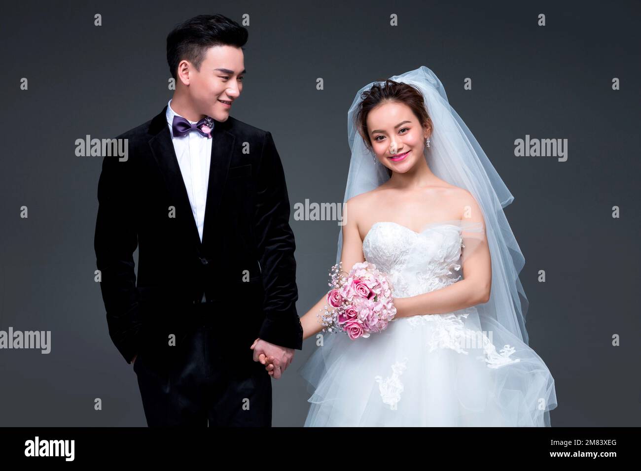 Happy and sweet bride and groom Stock Photo - Alamy