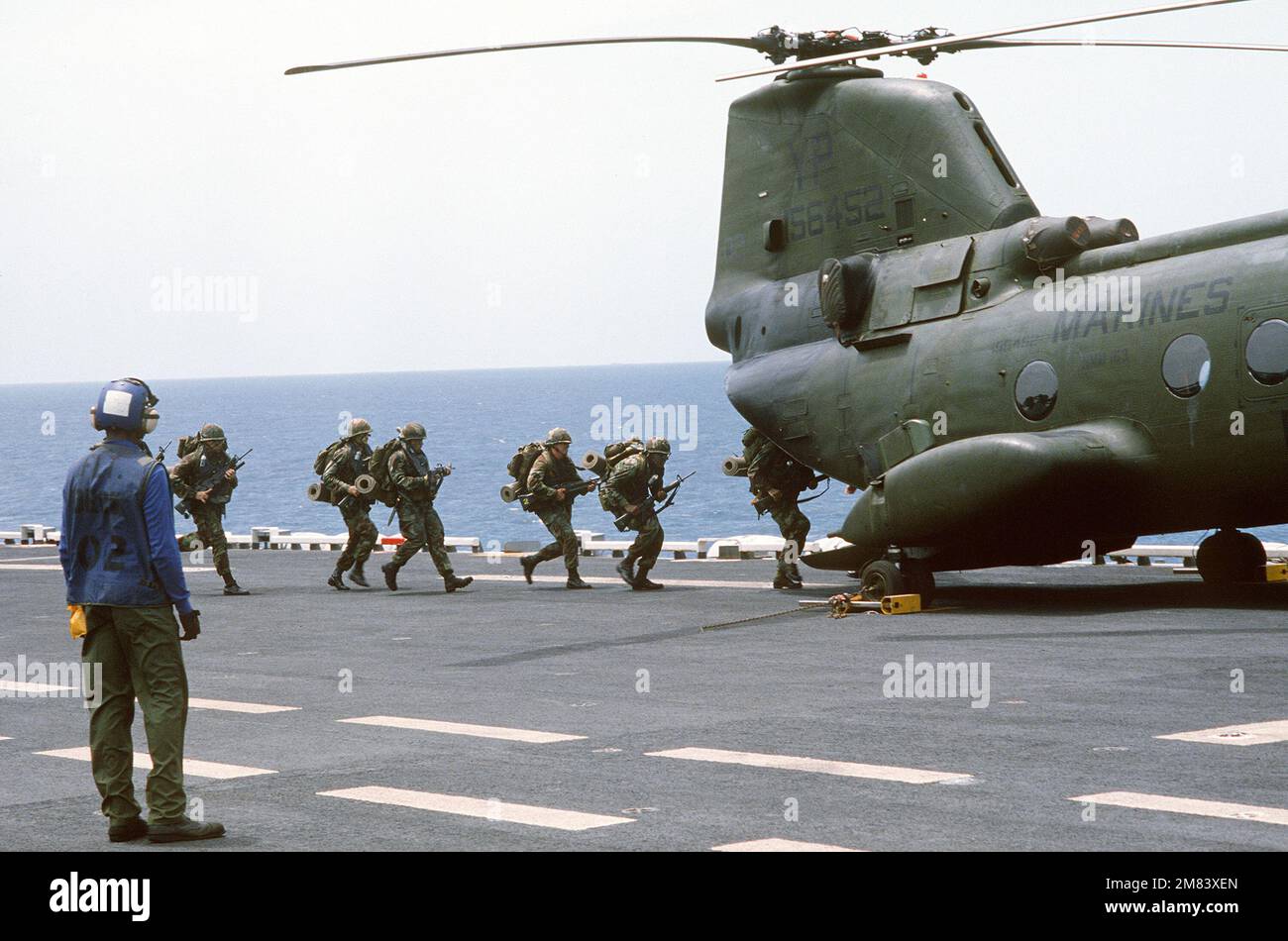 Members of the U.S. Army 25th Infantry board a Marine Corps CH-46E Sea ...