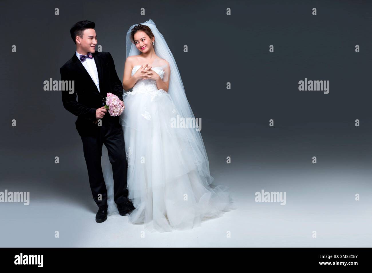 Happy and sweet bride and groom Stock Photo - Alamy
