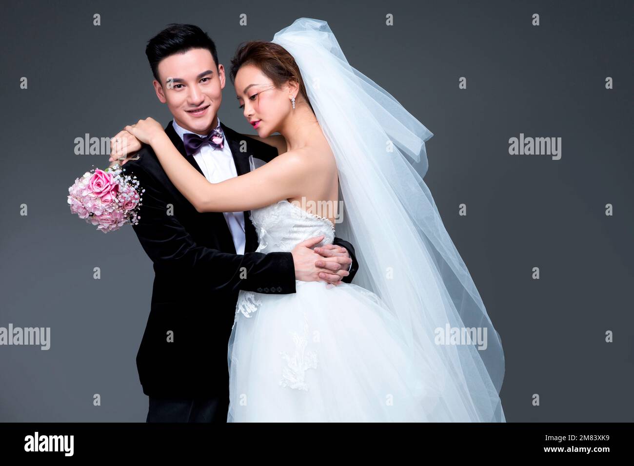 Happy and sweet bride and groom Stock Photo - Alamy