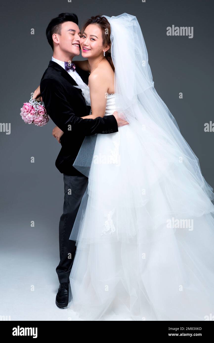 Happy and sweet bride and groom Stock Photo - Alamy
