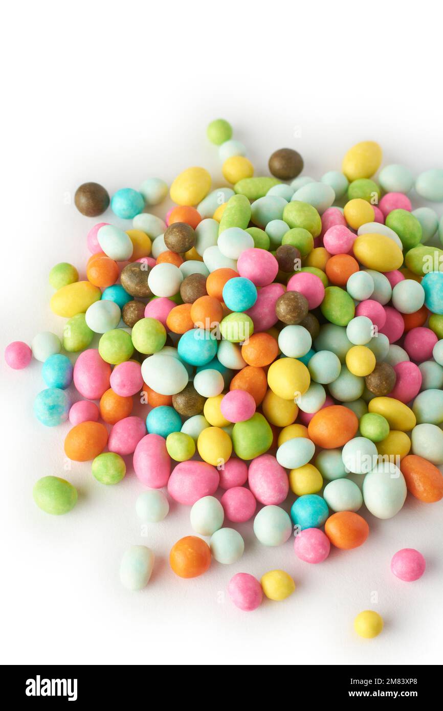 pile of colorful sweet balls, multicolor sugary candy isolated on white ...