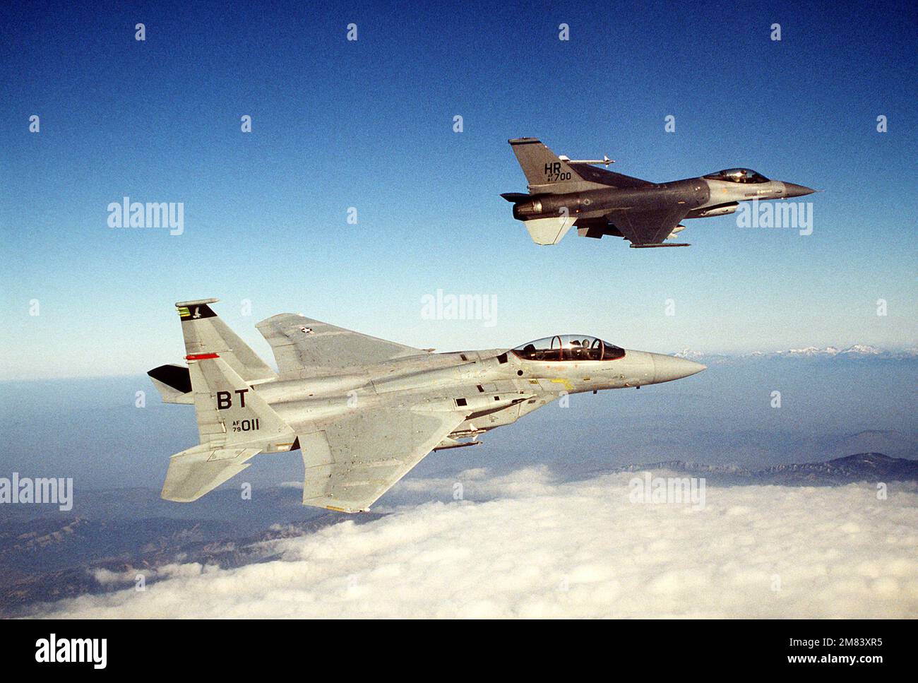 An air-to-air right side view of a 50th Tactical Fighter Wing F-16A ...