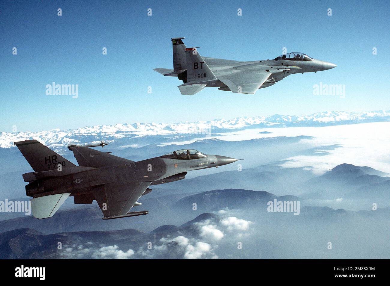 An air-to-air right side view of a 50th Tactical Fighter Wing F-16A ...