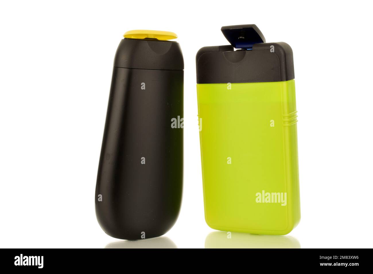 Two shampoos in plastic containers, macro, isolated on white background ...