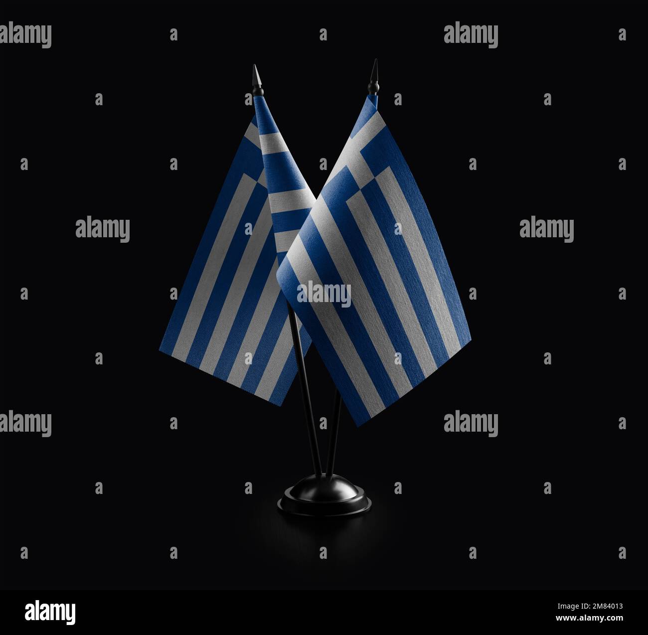 Small national flags of the Greece on a black background Stock Photo ...