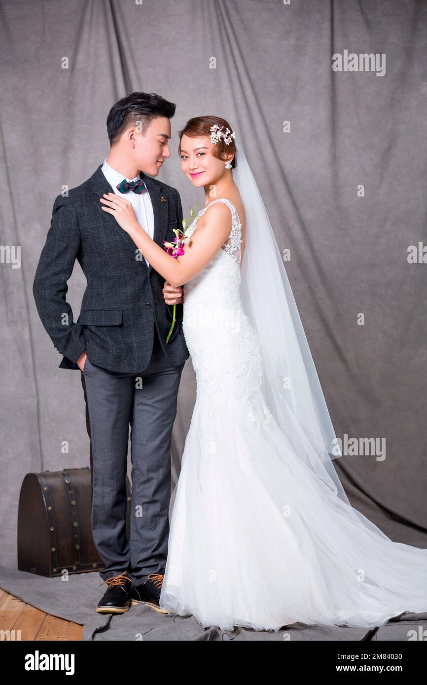 Happy and sweet bride and groom Stock Photo - Alamy