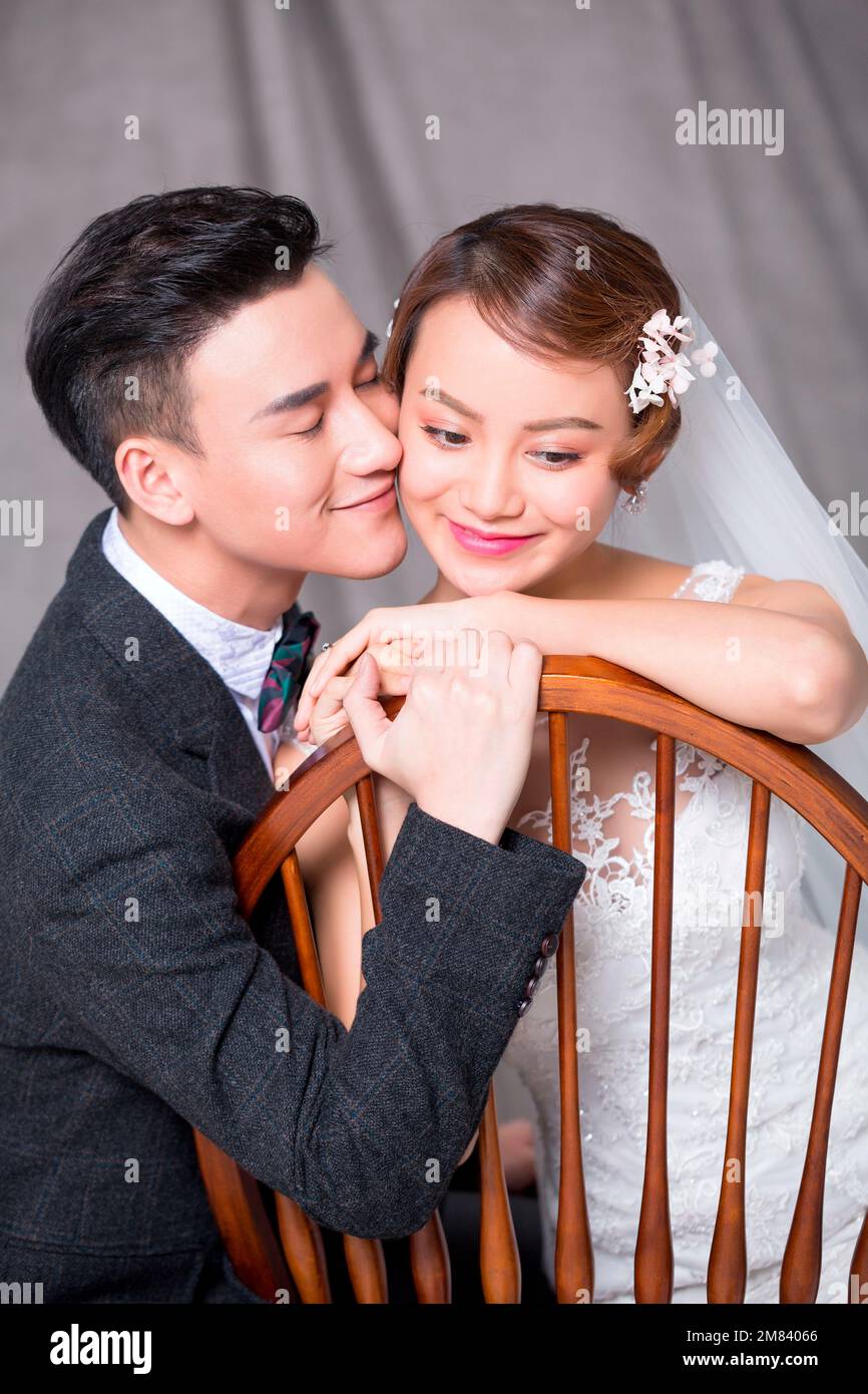 Happy and sweet bride and groom Stock Photo - Alamy