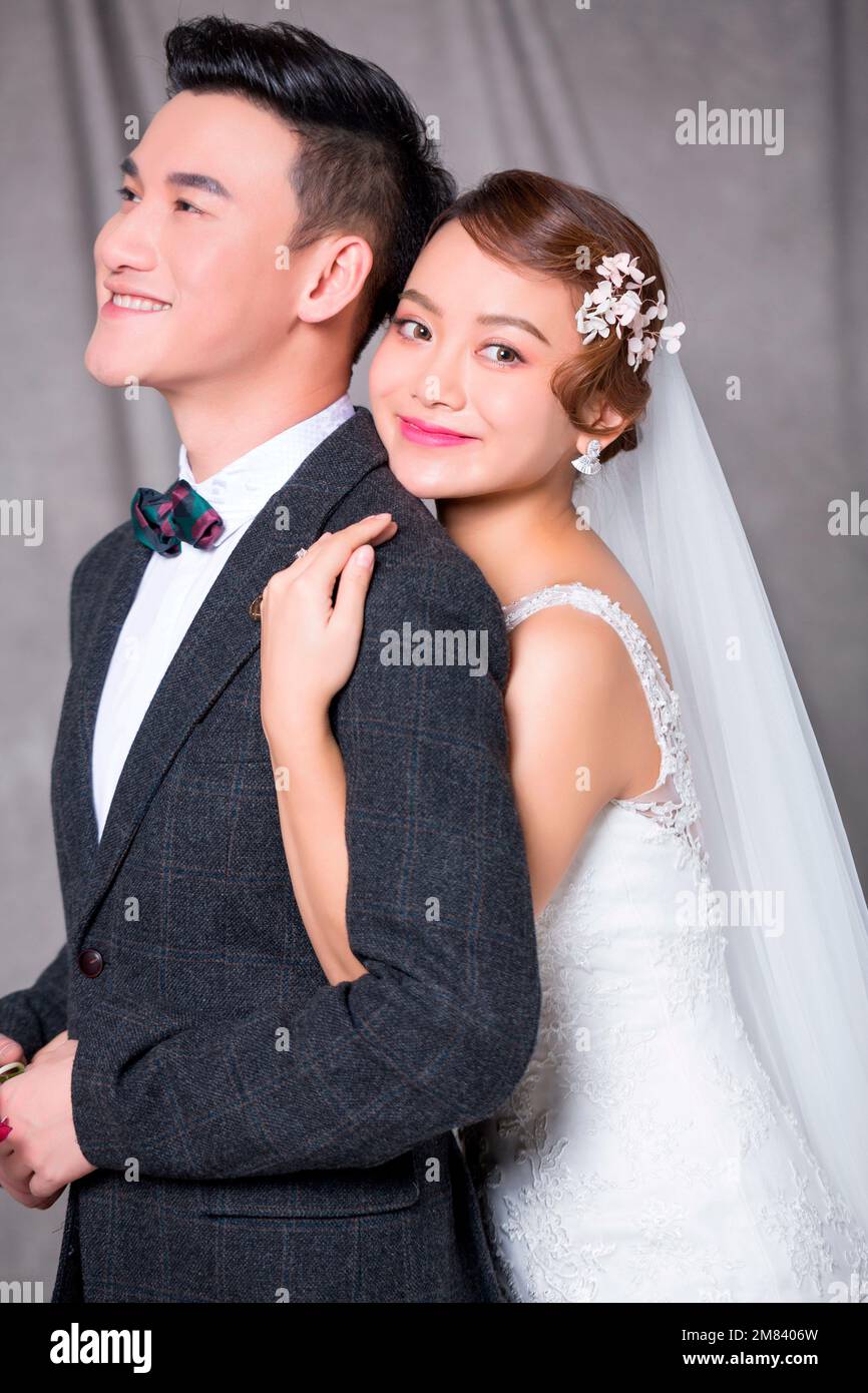 Happy and sweet bride and groom Stock Photo - Alamy