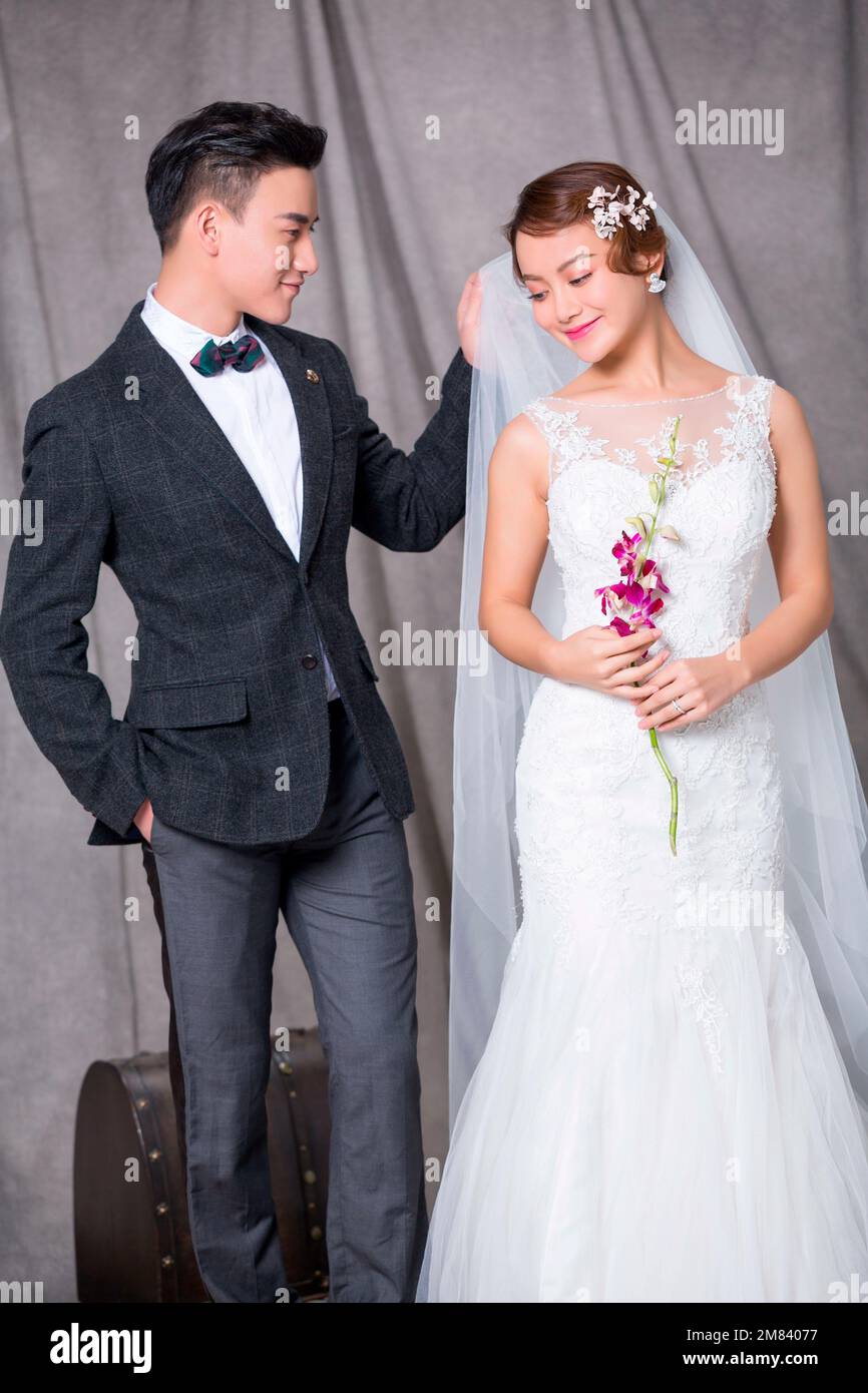 Happy and sweet bride and groom Stock Photo - Alamy
