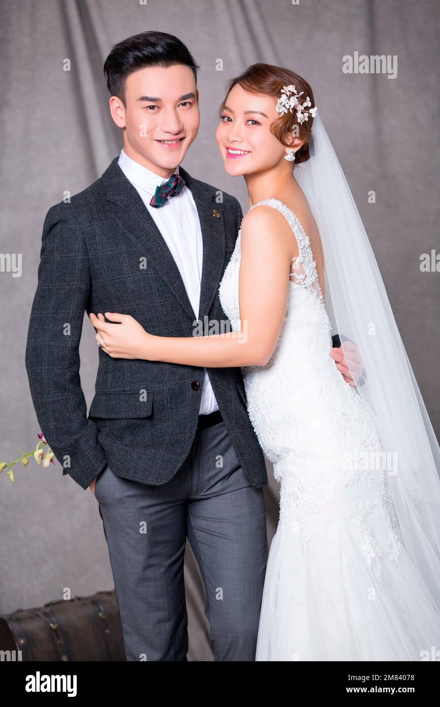 Happy and sweet bride and groom Stock Photo - Alamy