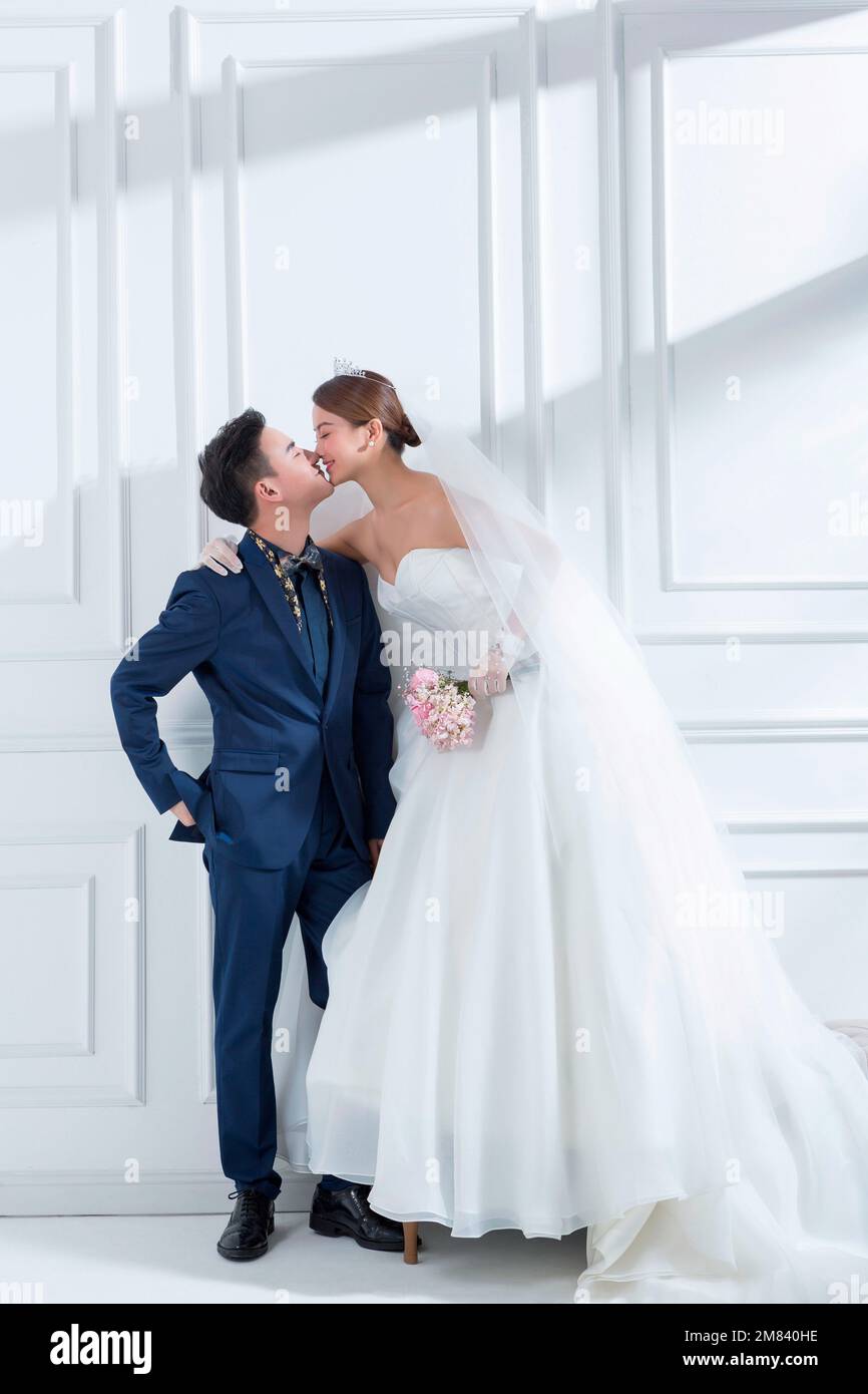 Happy and sweet bride and groom Stock Photo - Alamy