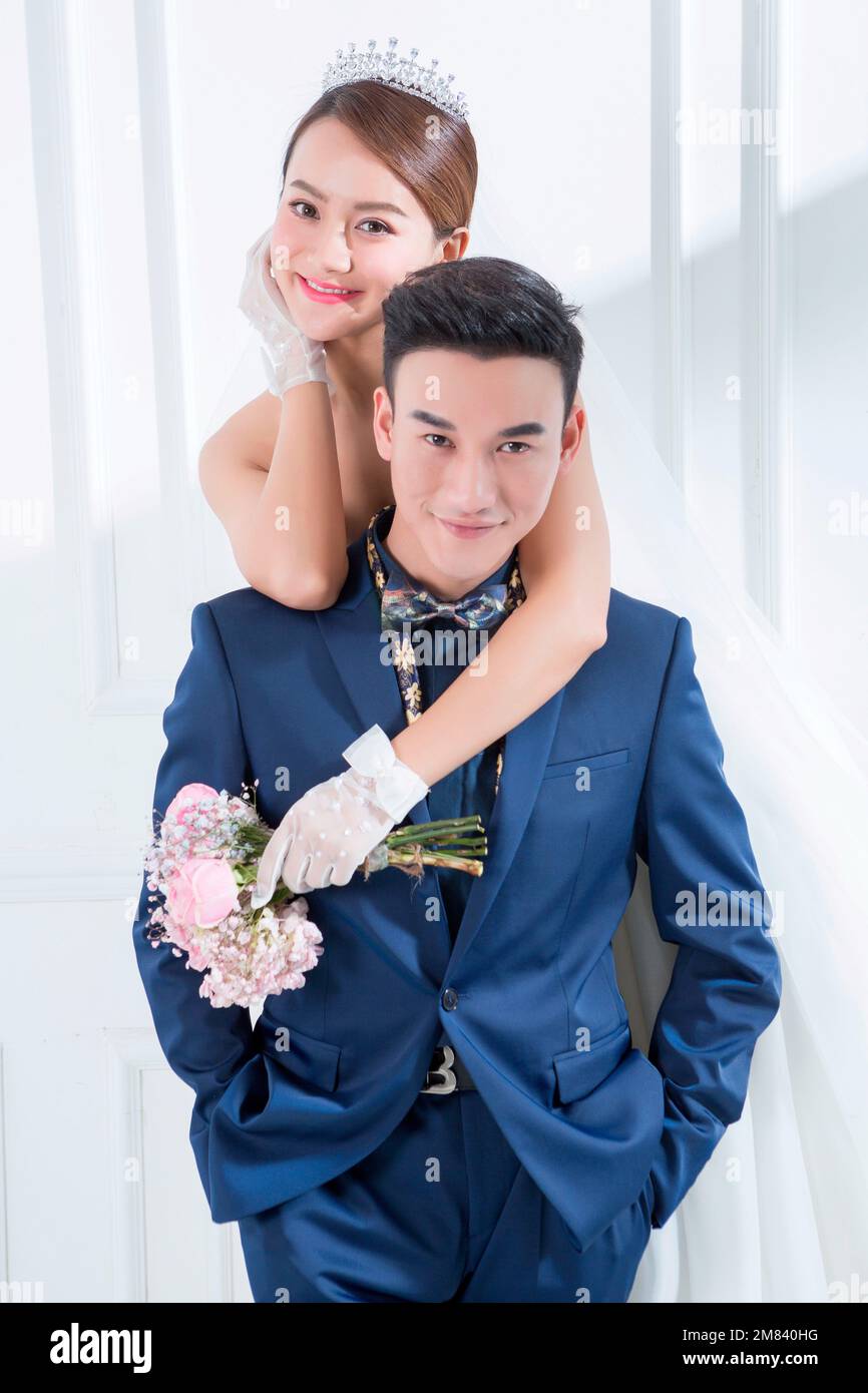 Happy and sweet bride and groom Stock Photo - Alamy