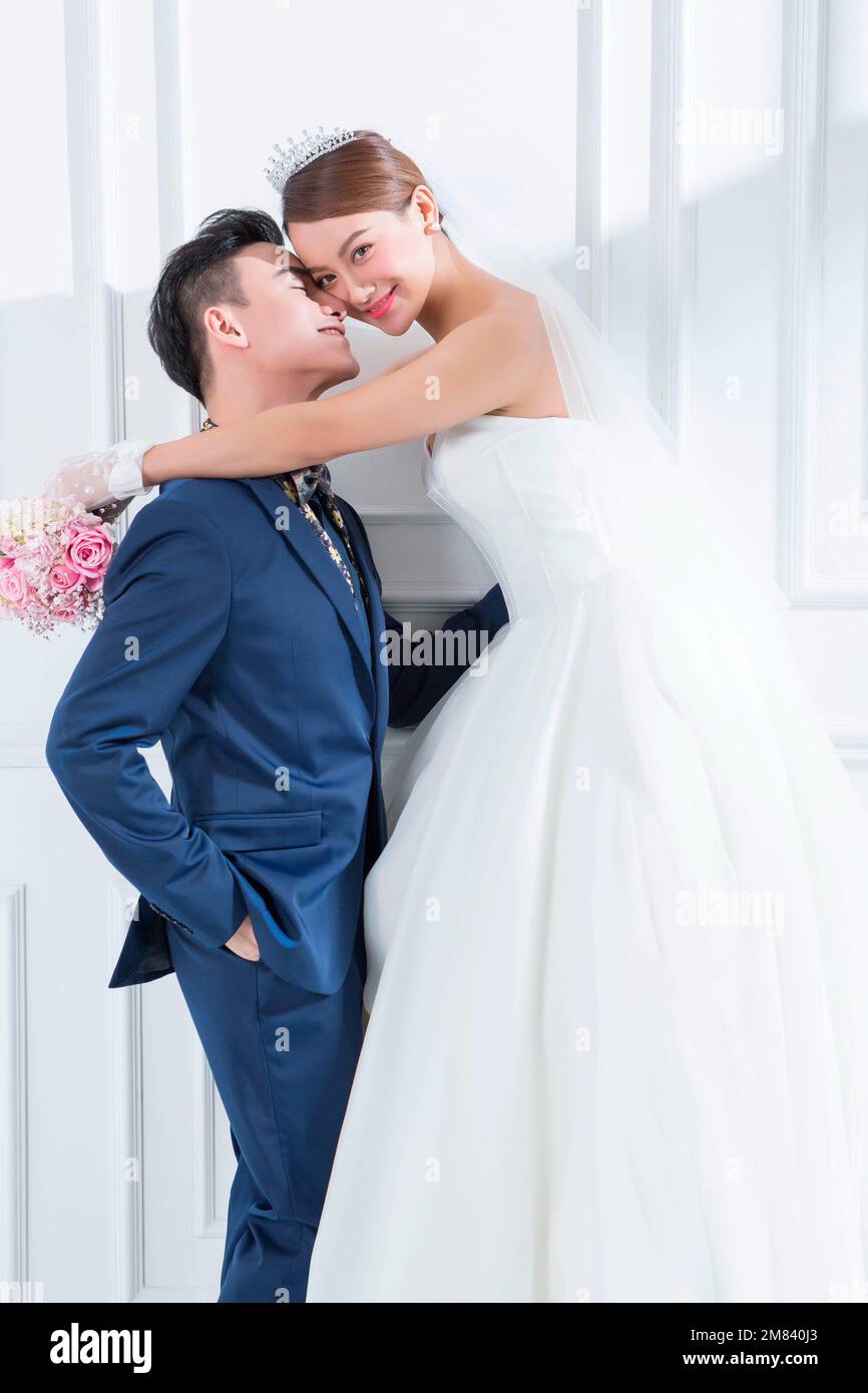 Happy and sweet bride and groom Stock Photo - Alamy