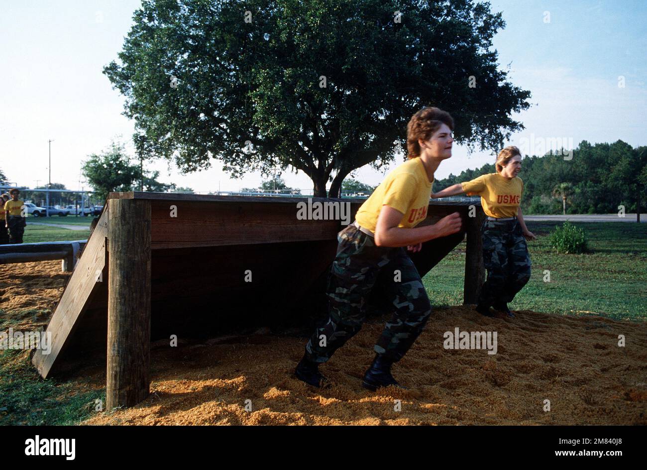 Women Marine recruits complete a section of the challenge course during ...