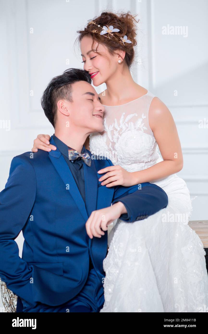 Happy and sweet bride and groom Stock Photo - Alamy