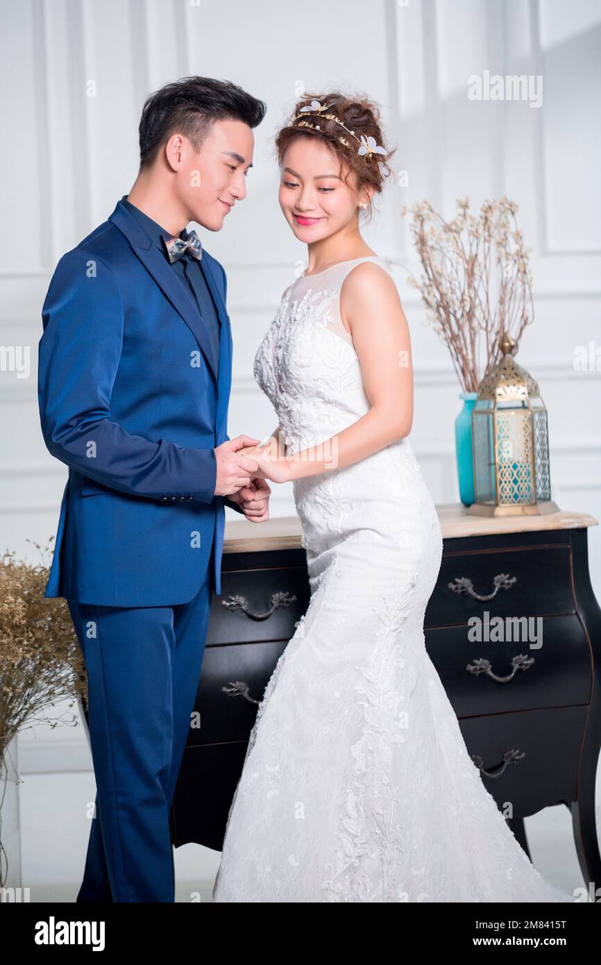 Happy and sweet bride and groom Stock Photo - Alamy
