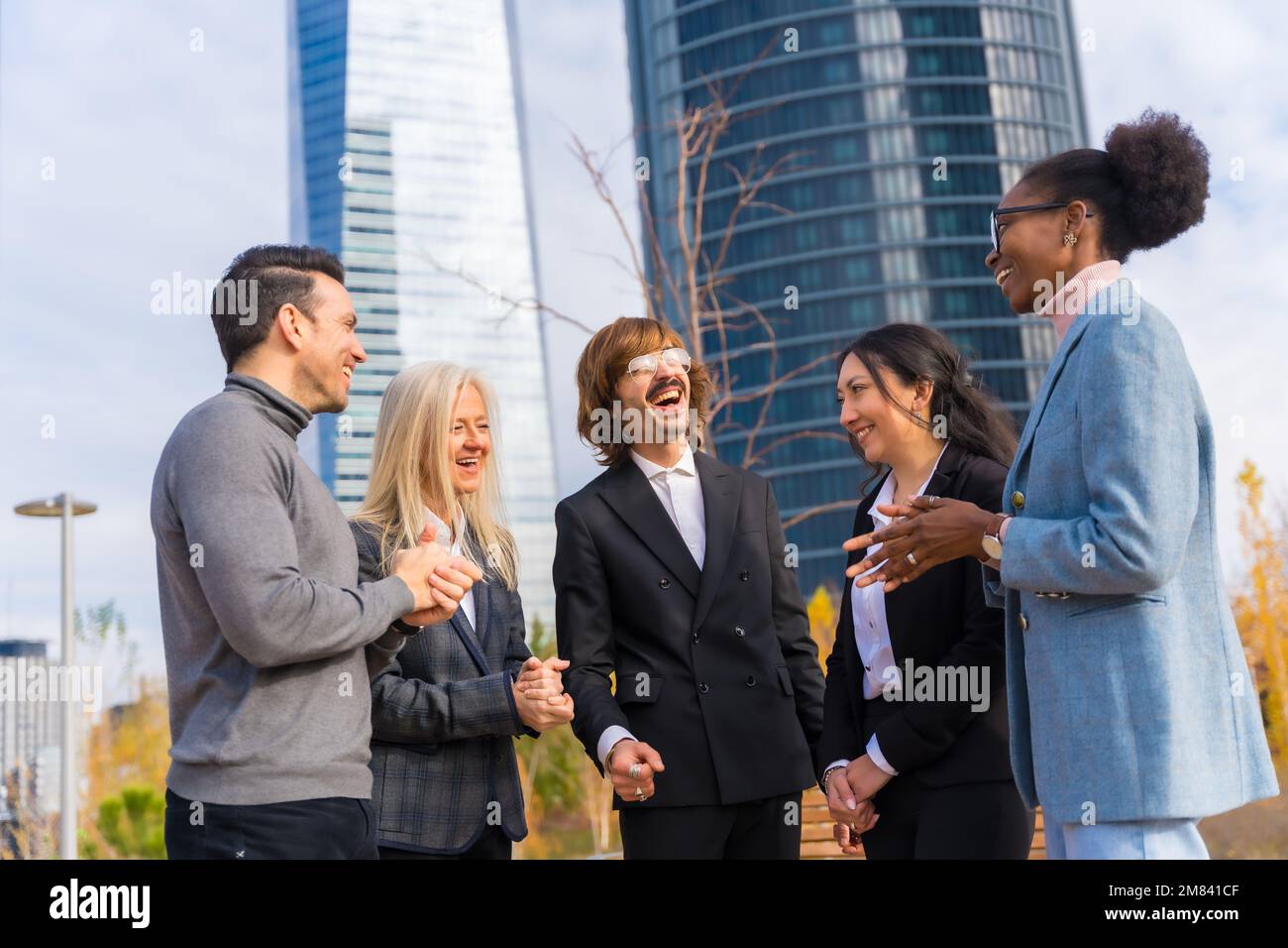 A Group Of Multi Ethnic Businessmen And Businesswomen Talking About