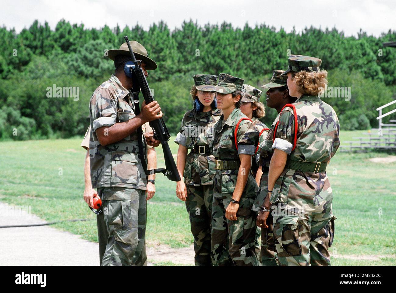 Marine drill instructors discuss the M-16A2 rifle on the range at the ...