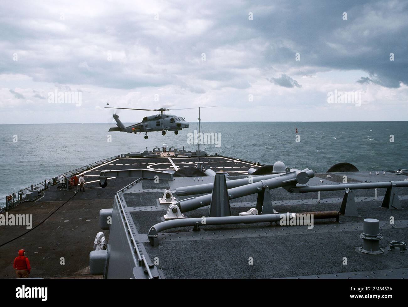 An SH-60B Sea Hawk helicopter participates in flight operations aboard ...