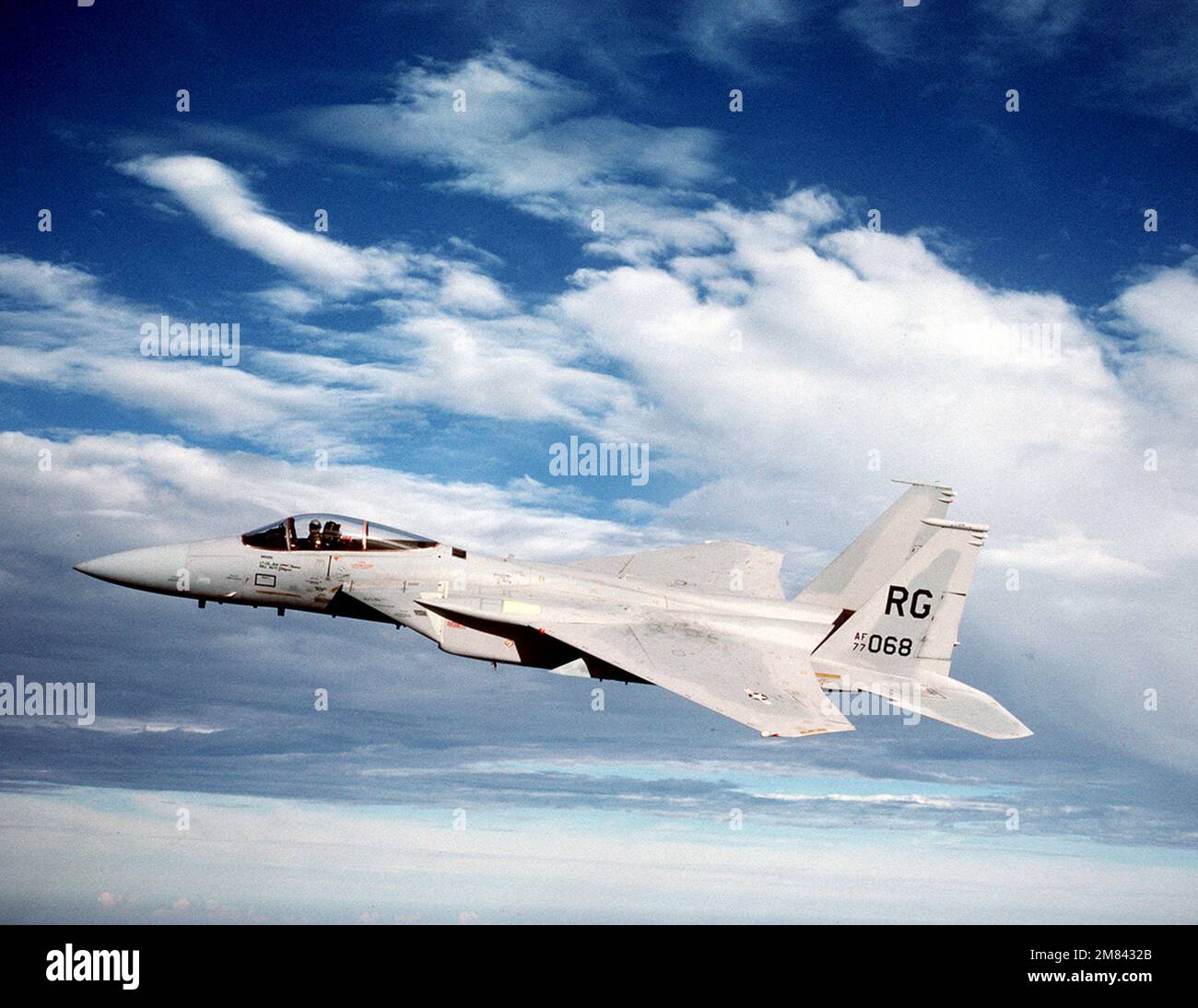 An air-to-air left side view of an F-15 Eagle test bed aircraft ...