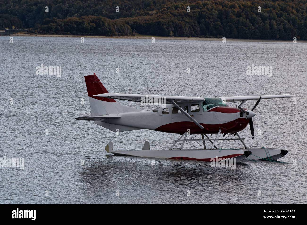 A float plane is floating on a lake waiting for its passengers Stock ...