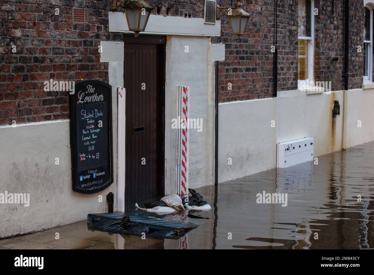 The Lowther public house without its flood defences in place is flooded ...