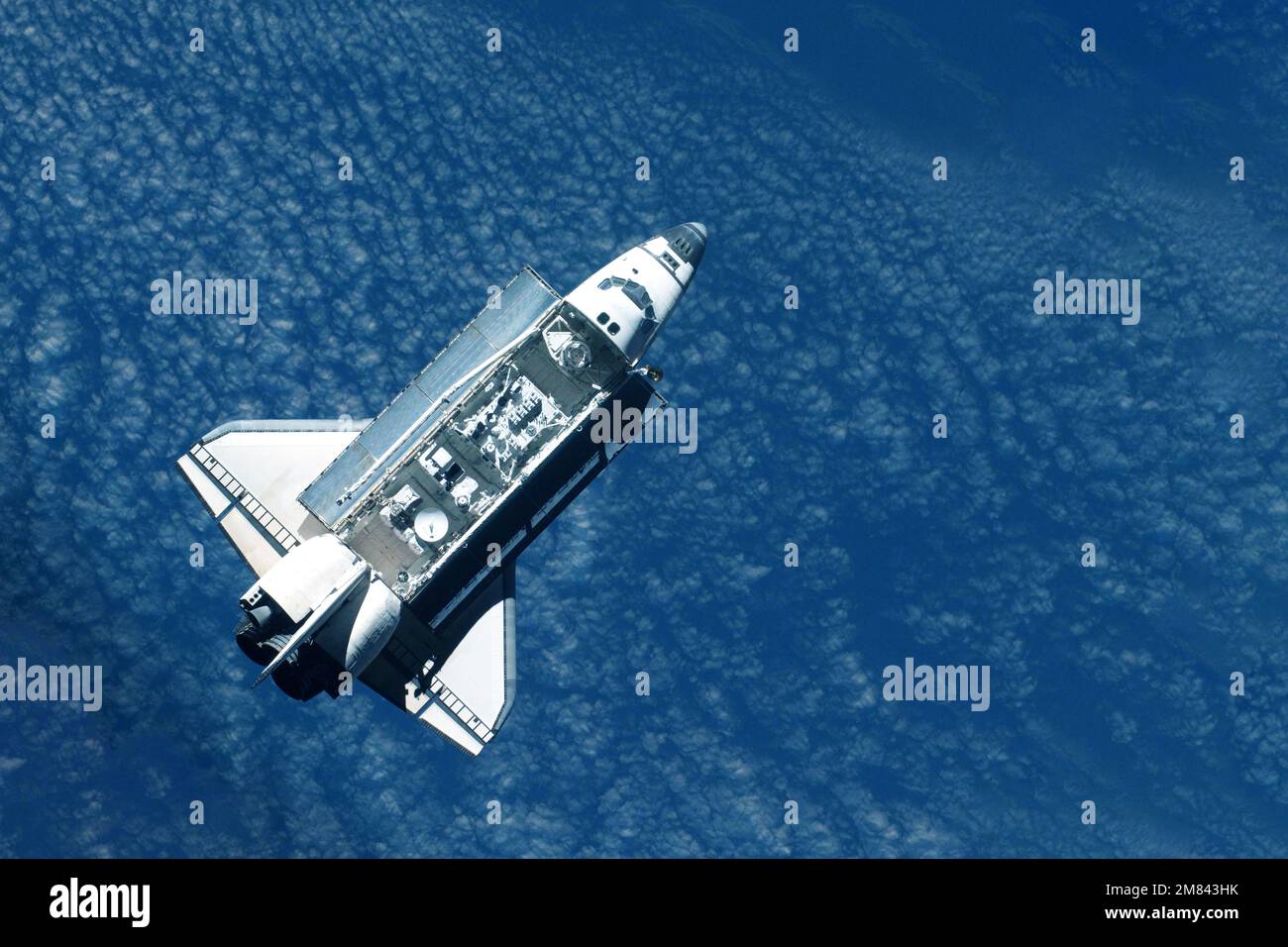 Space shuttle above the surface of the Earth. Elements of this image ...