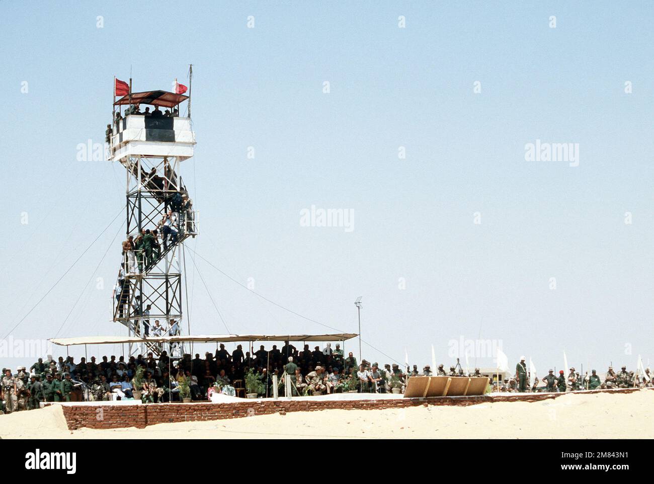 Spectators watch a combined arms live fire demonstration from a VIP ...