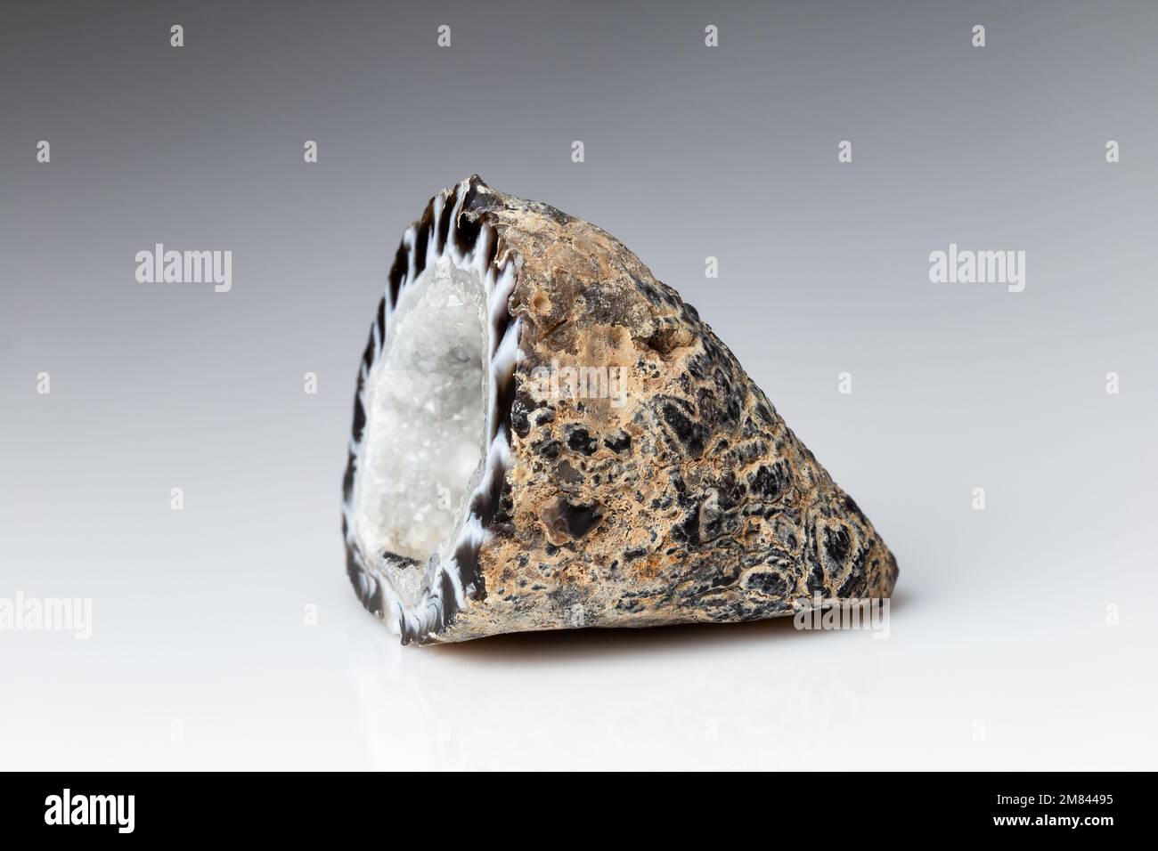 Agate Geode with Hyaline Quartz Crystals on Grey Background. A Cross ...