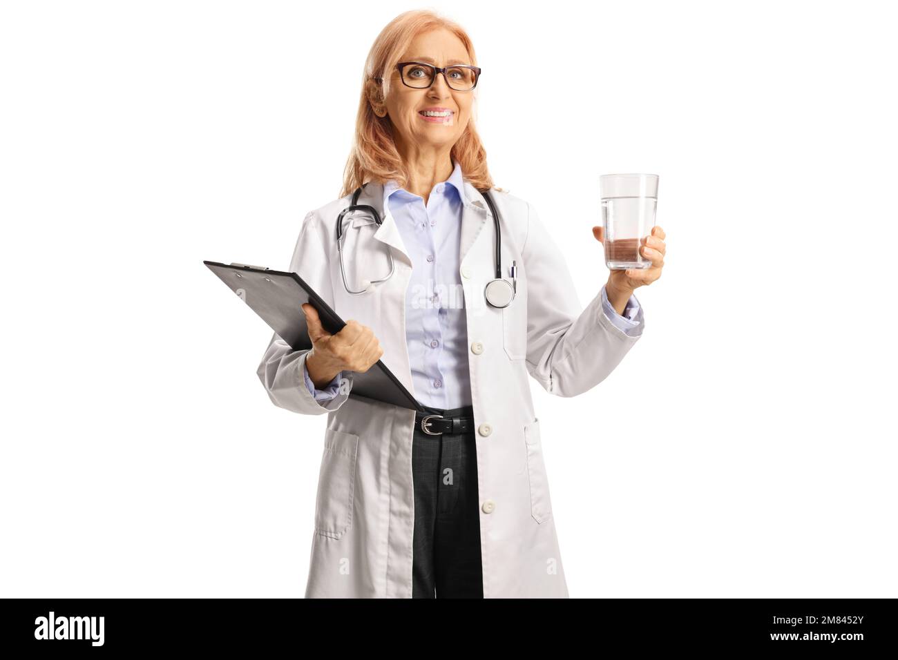 Female doctor holding a glass of water and smiling isolated on white ...