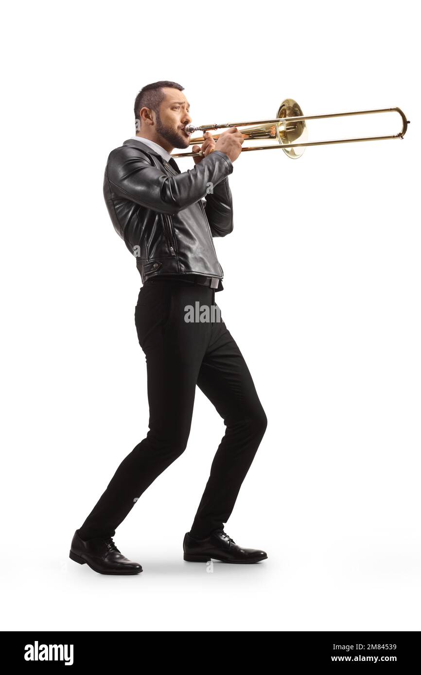 Full length shot of a modern male musician playing a trombone isolated ...