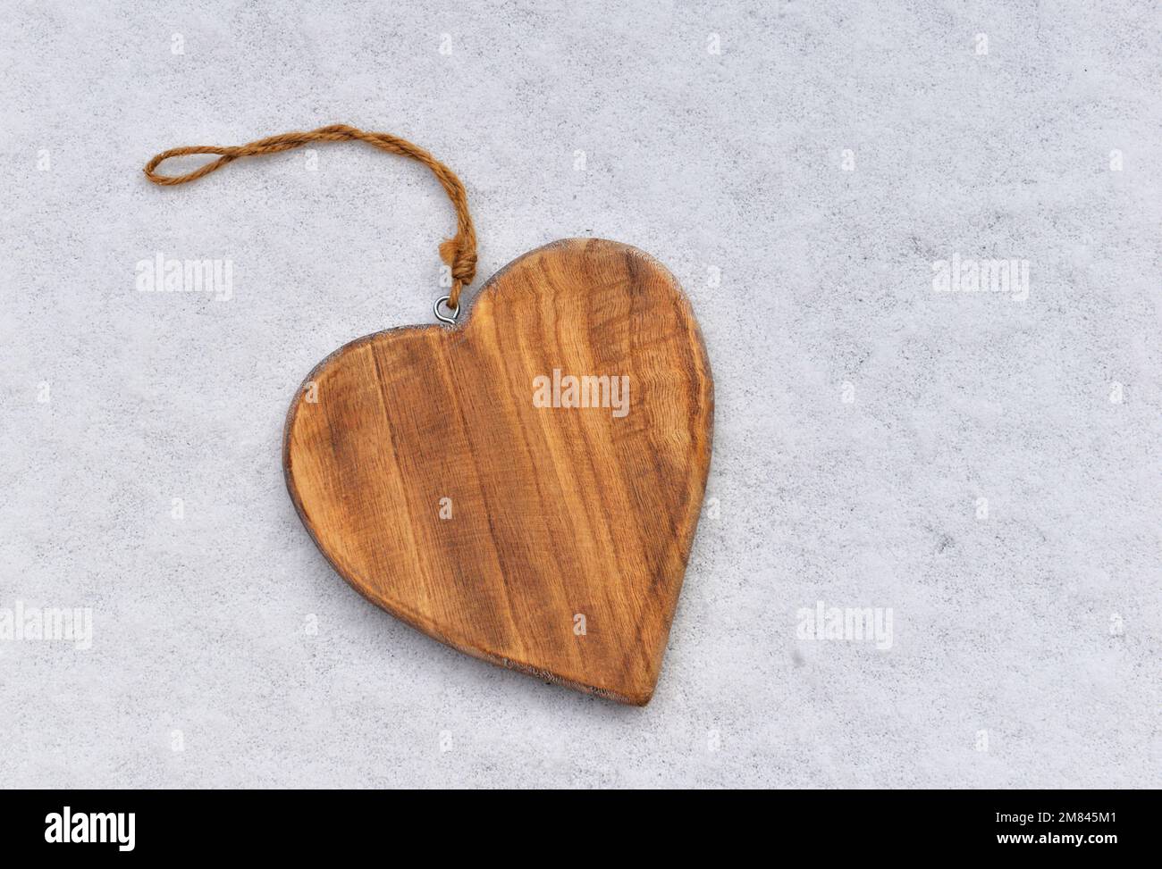 closeup on decorative wooden shape heart on the snow Stock Photo - Alamy