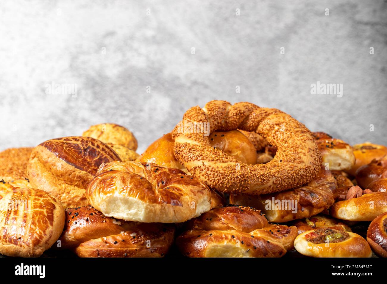 Bagel and pogaca varieties. They eat pastries in piles. Bakery products ...
