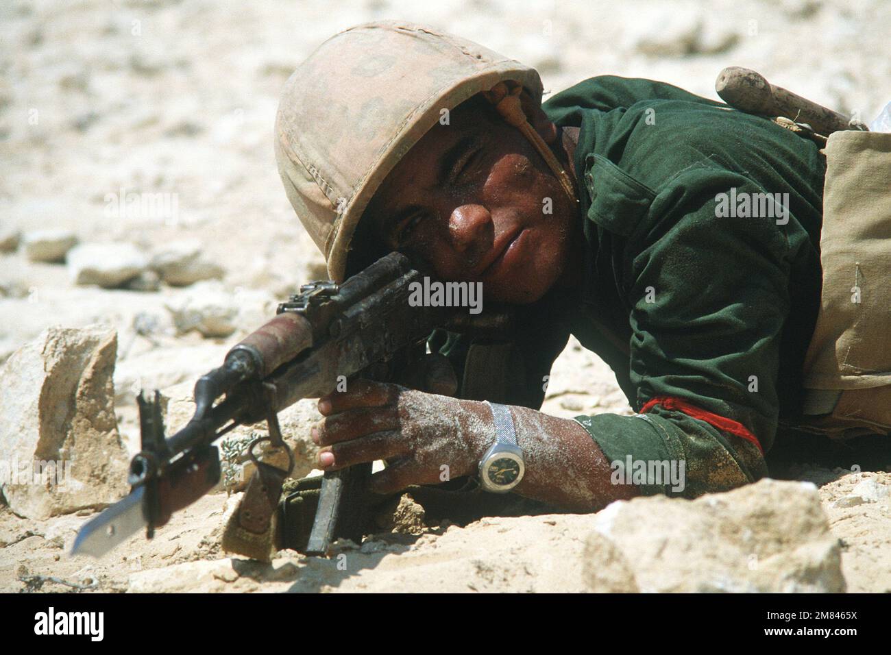 An Egyptian marine aims an AKM 7.62mm rifle during an amphibious ...