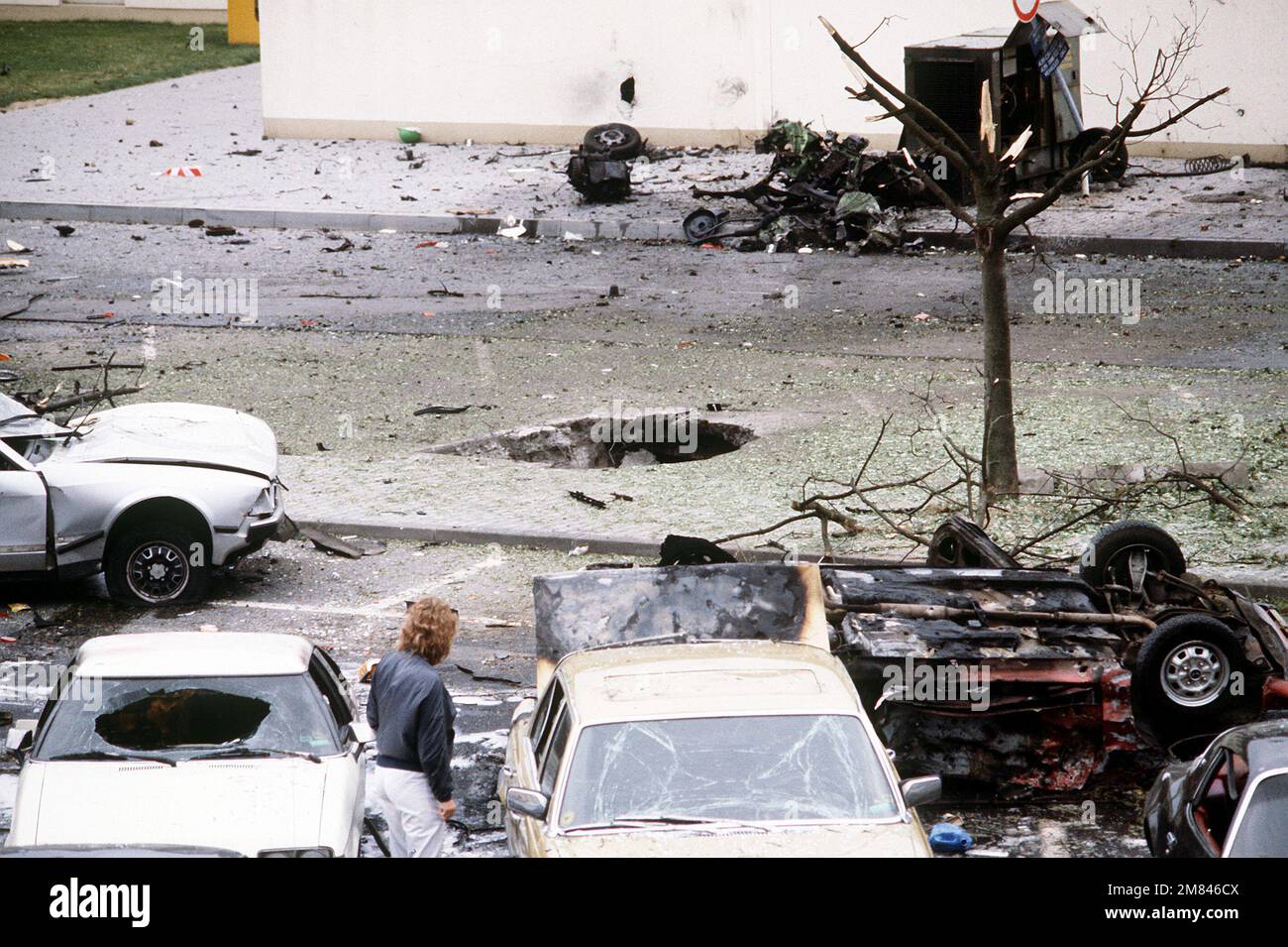An elevated view of the crater in the parking lot which resulted after ...