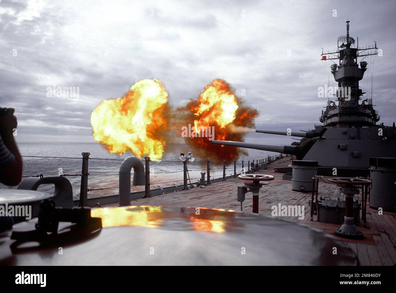A salvo is fired from the No. 2 Mark 7 16-inch/50-caliber gun turret ...