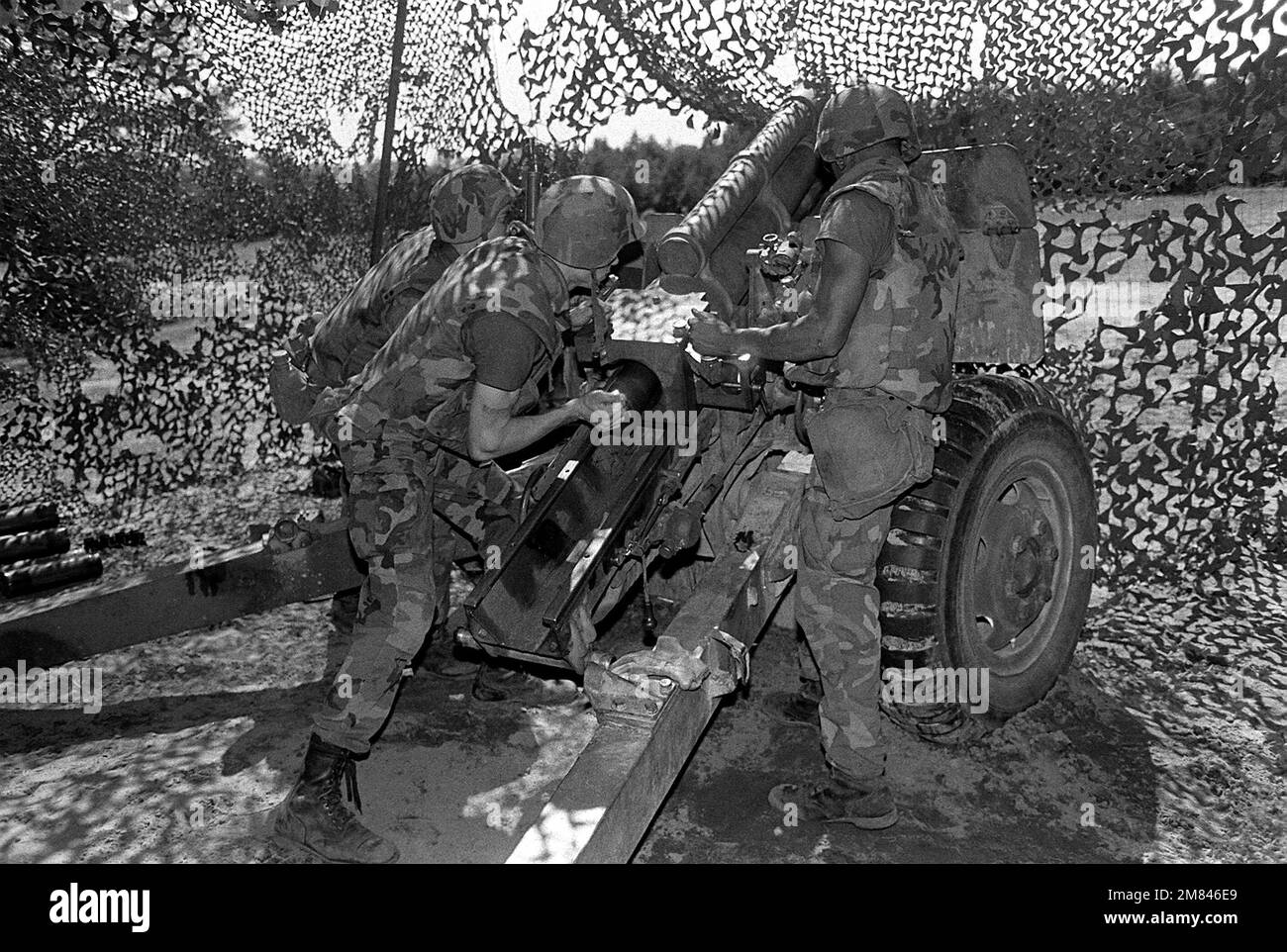 A Marine from Battery H, 3rd Bn., 14th Marines, loads a round into an M ...