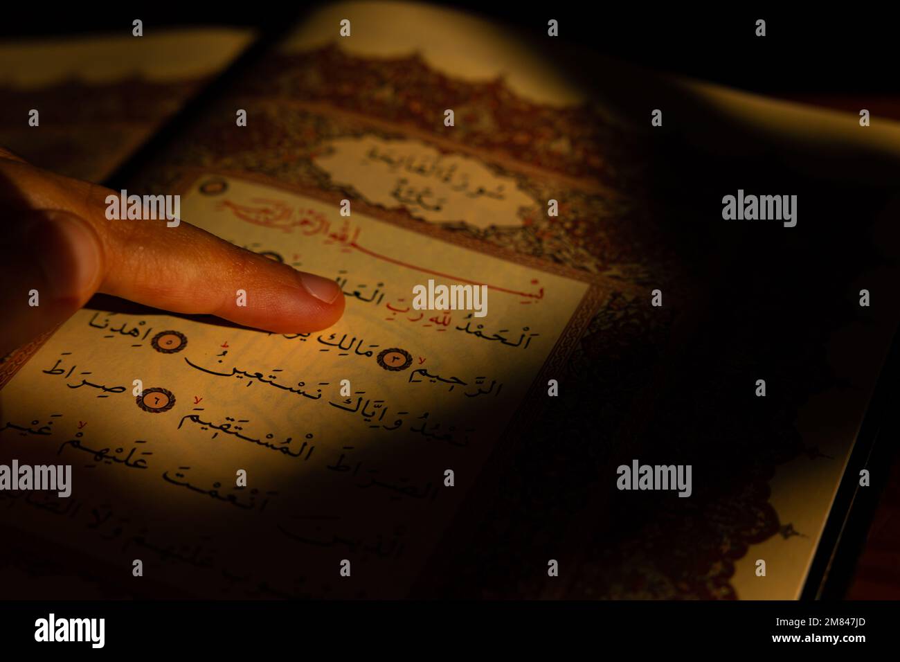 Reading the Holy Quran. Islamic background photo with copy space for ...