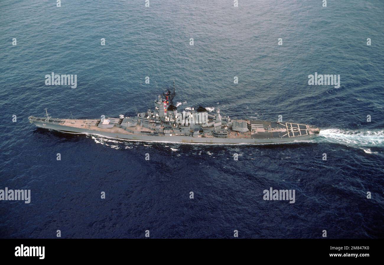 A high angle port beam view of the battleship USS IOWA (BB 61) underway off the coast of ...